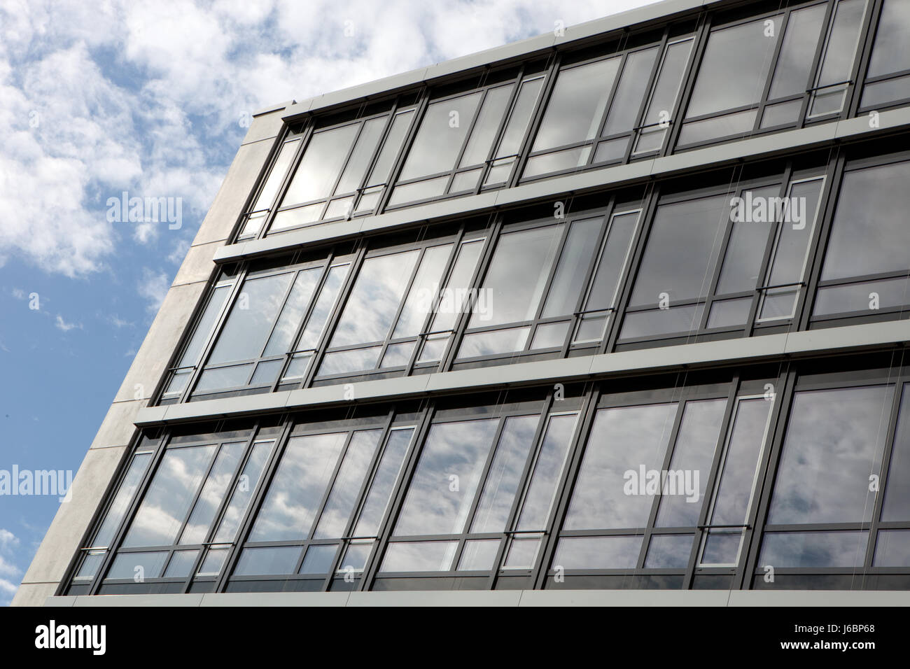 mirrored facade of an office building Stock Photo - Alamy