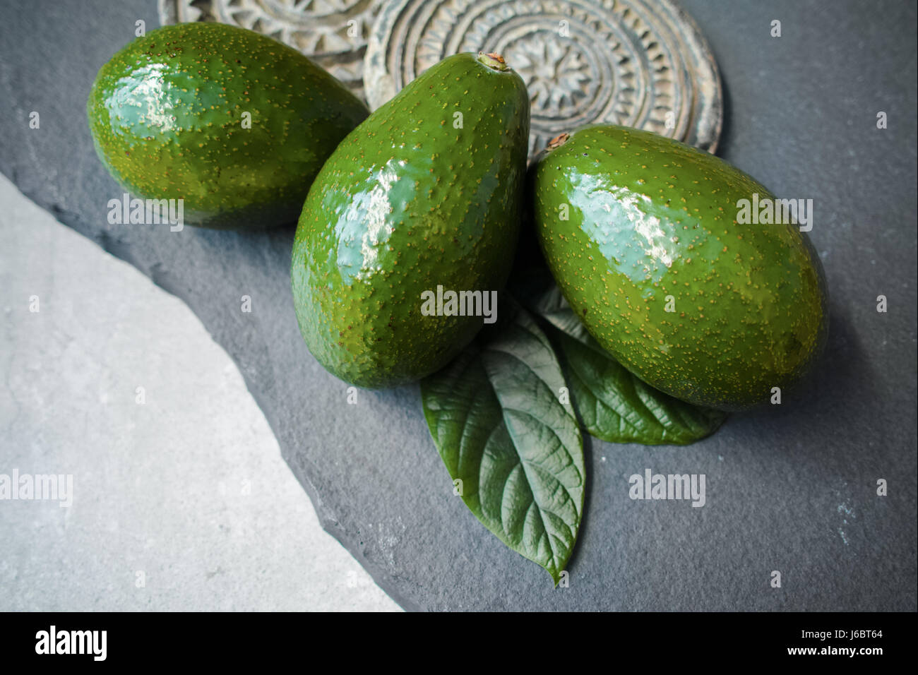 Green ripe tropical vegetable avocados ready to eat Stock Photo - Alamy