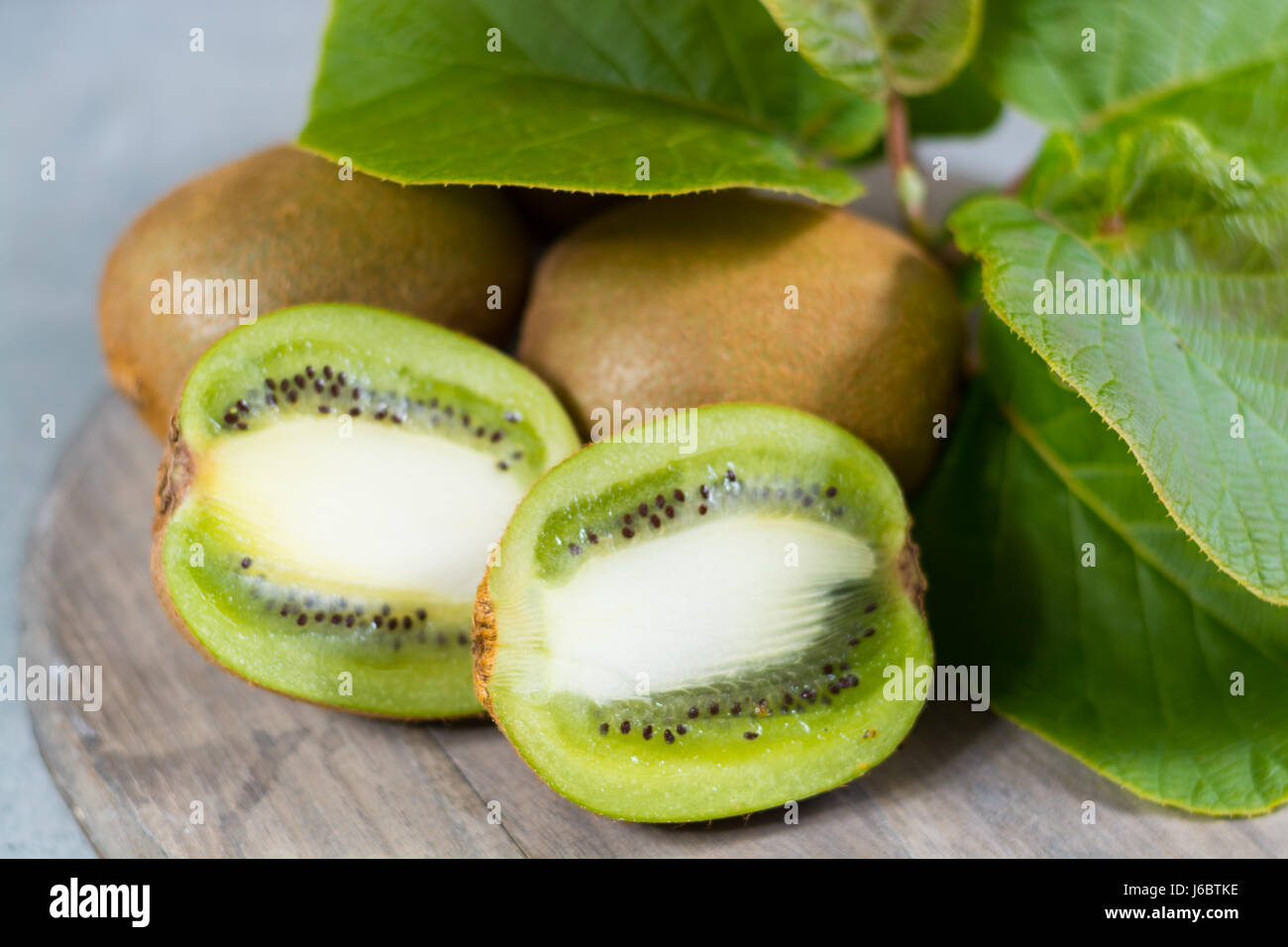 Tropical ripe organic sweet green kiwi fruit with leaves ready to eat ...