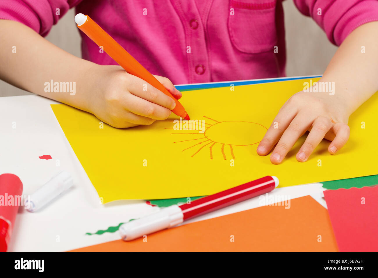 Child is drawing with felttip pen Stock Photo - Alamy