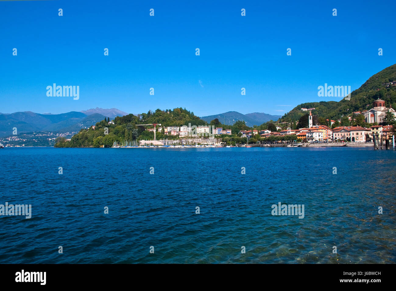 europe italy house building city town tree mountains alps waves ...