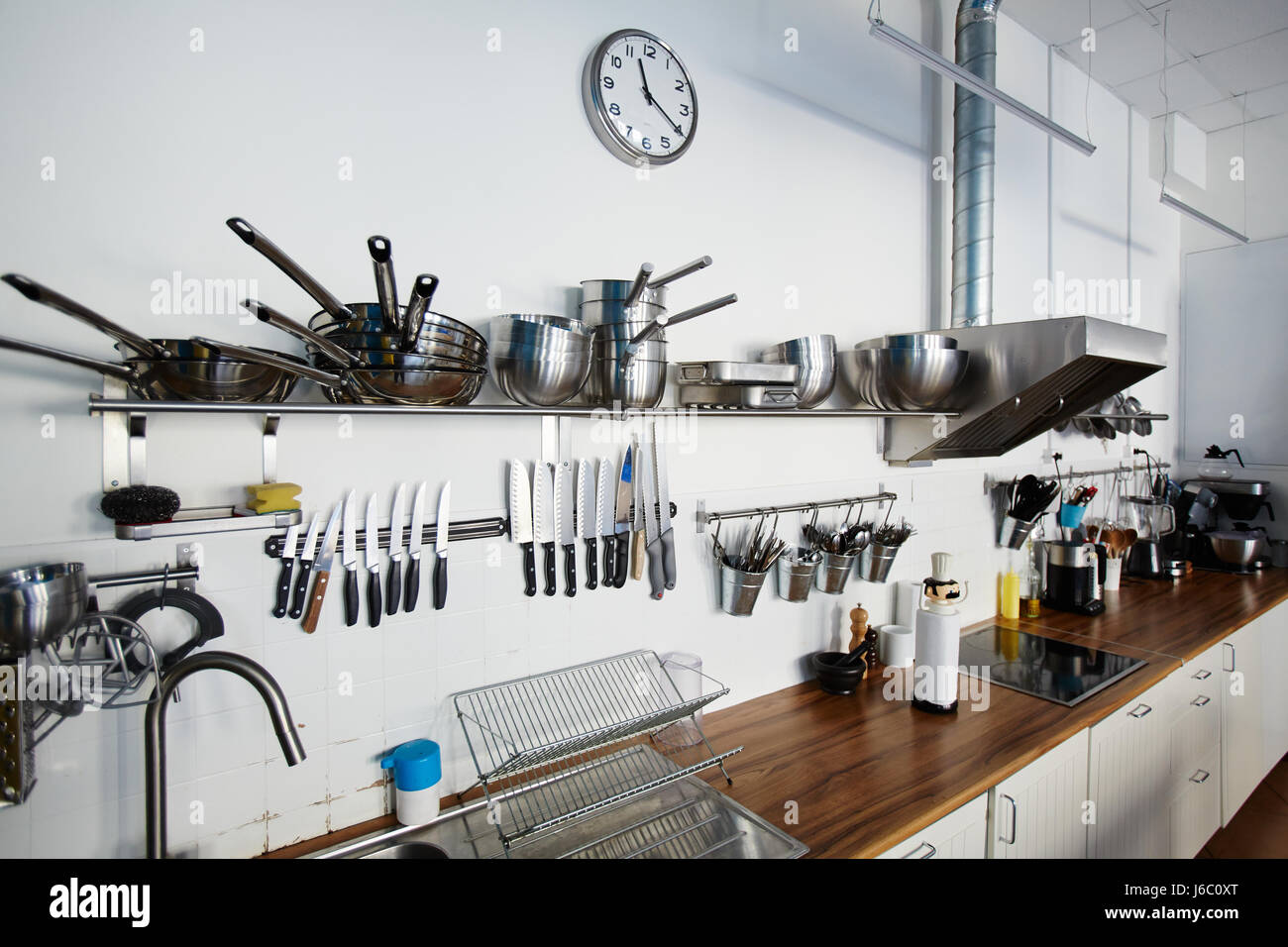 Various types of metallic kitchenware and workplace of chef Stock Photo ...