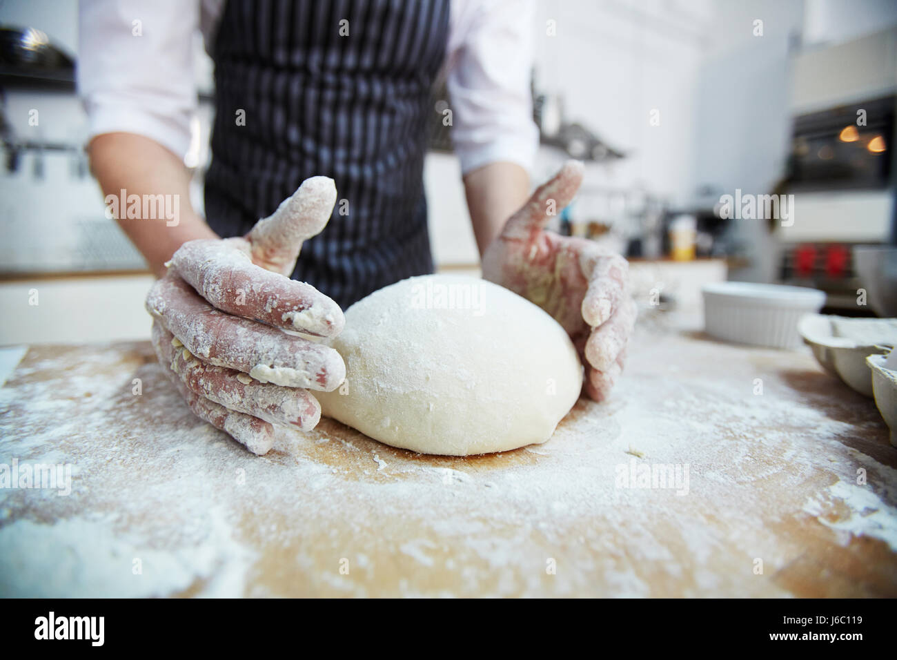 Hands of baker forming bread from dough Stock Photo - Alamy