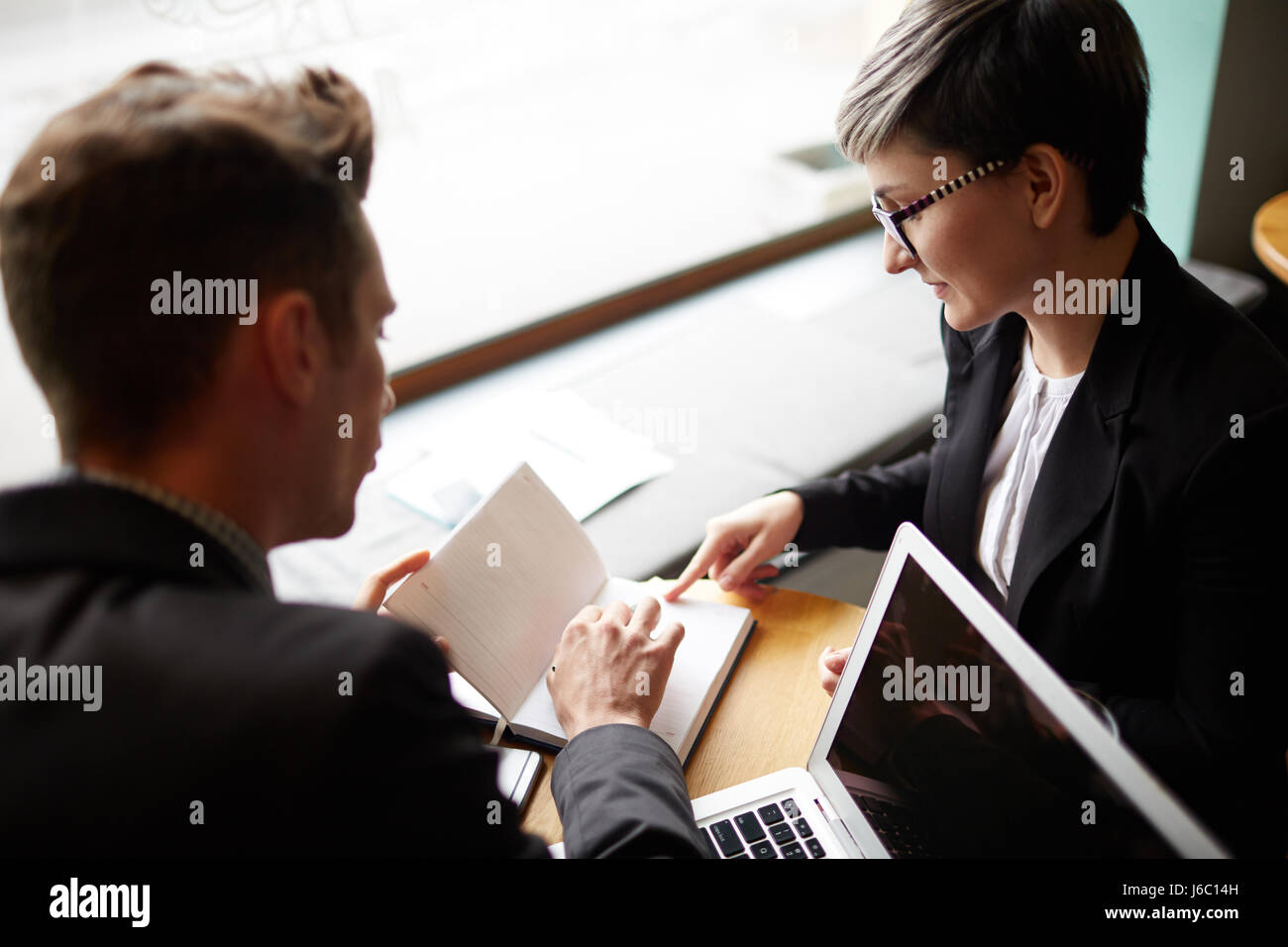 Business team brainstorming checking hi-res stock photography and ...