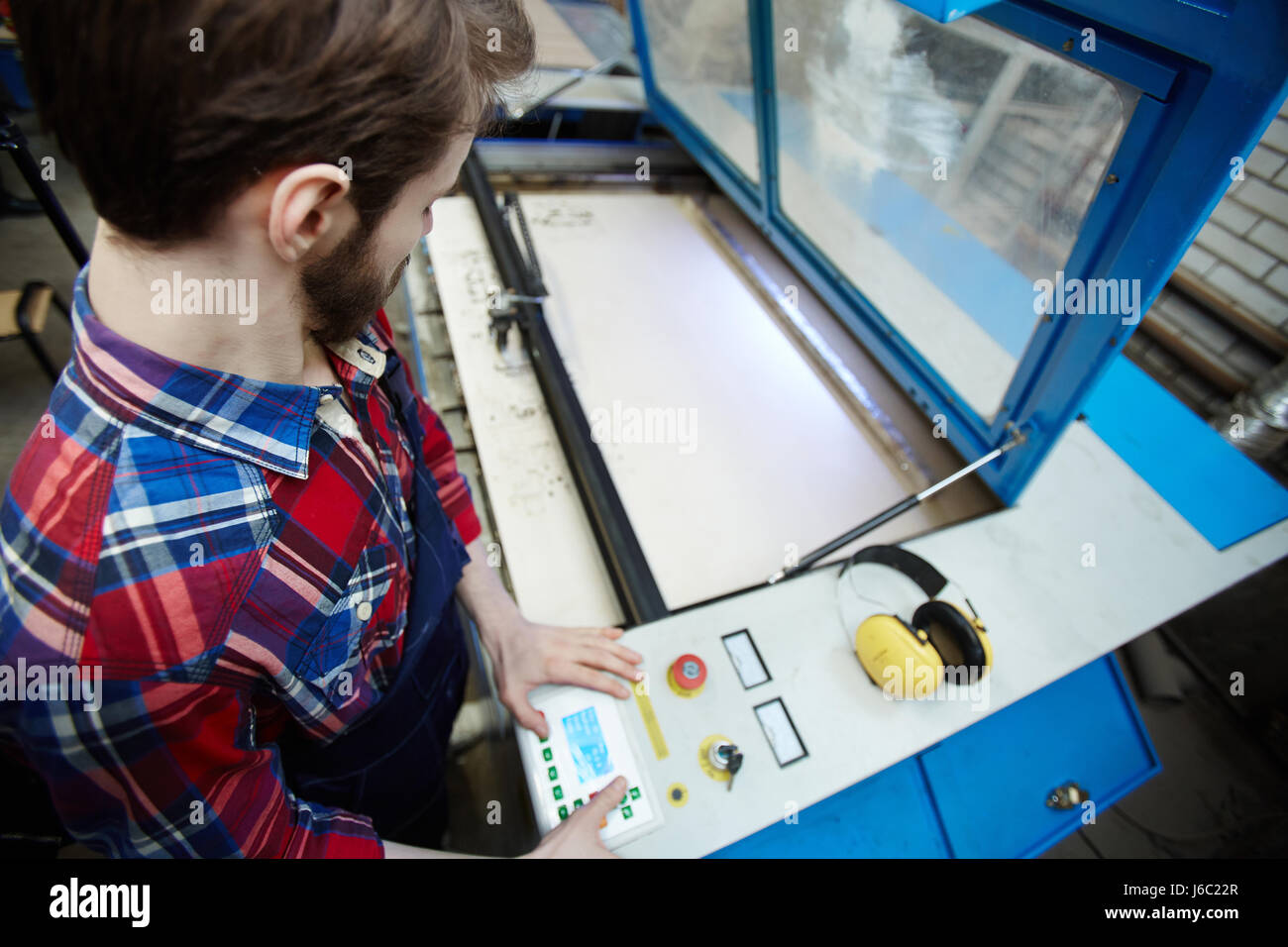 Man operating machines hi-res stock photography and images - Alamy