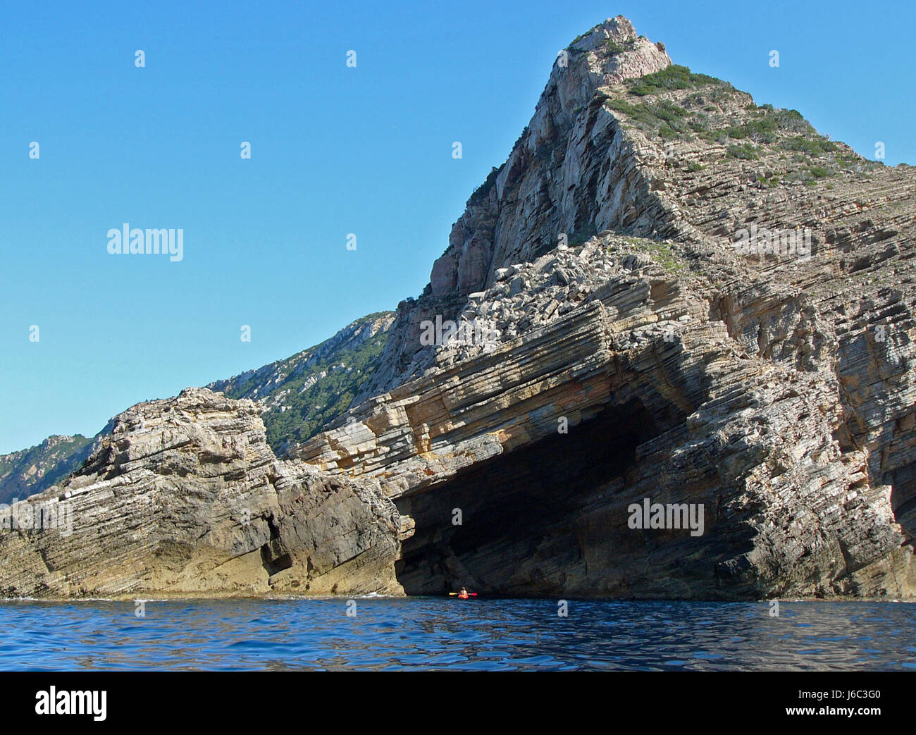 rock paddle triangle grotto stratification salt water sea ocean water ...