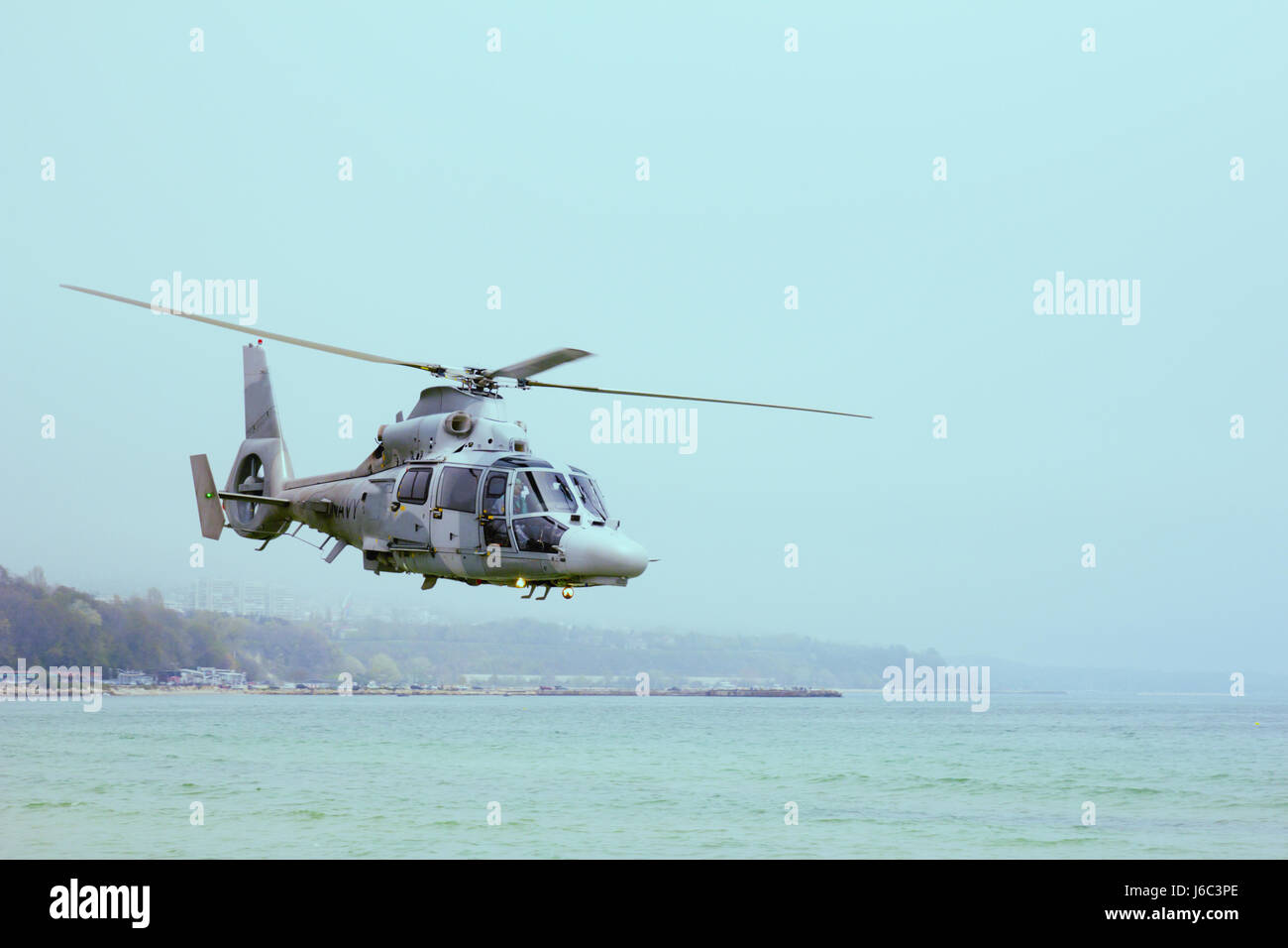 Military navy helicopter landing with a headlights closeup isolated ...
