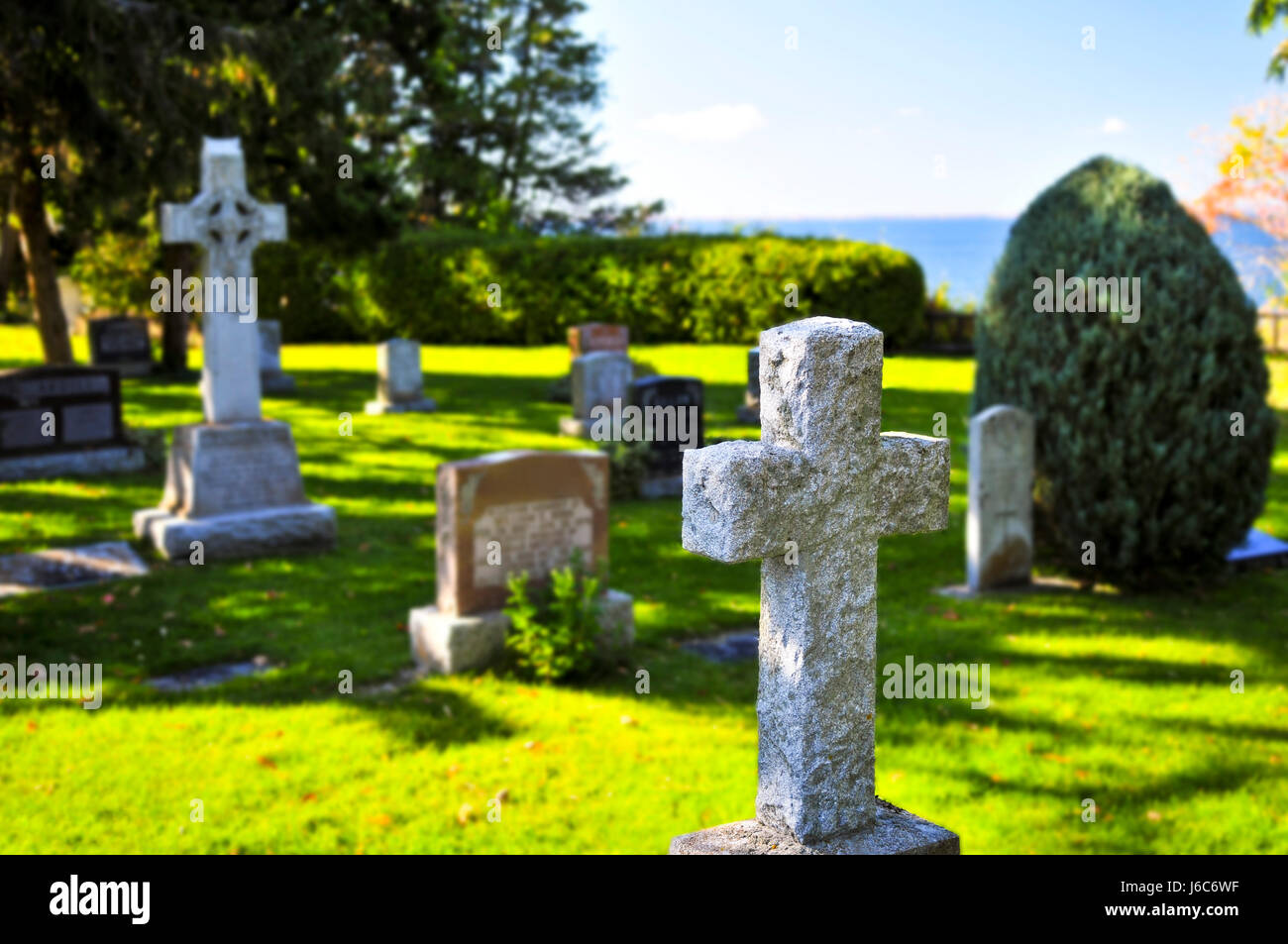 cross cemetery gravestone tombstone grave graveyard lawn green monument ...