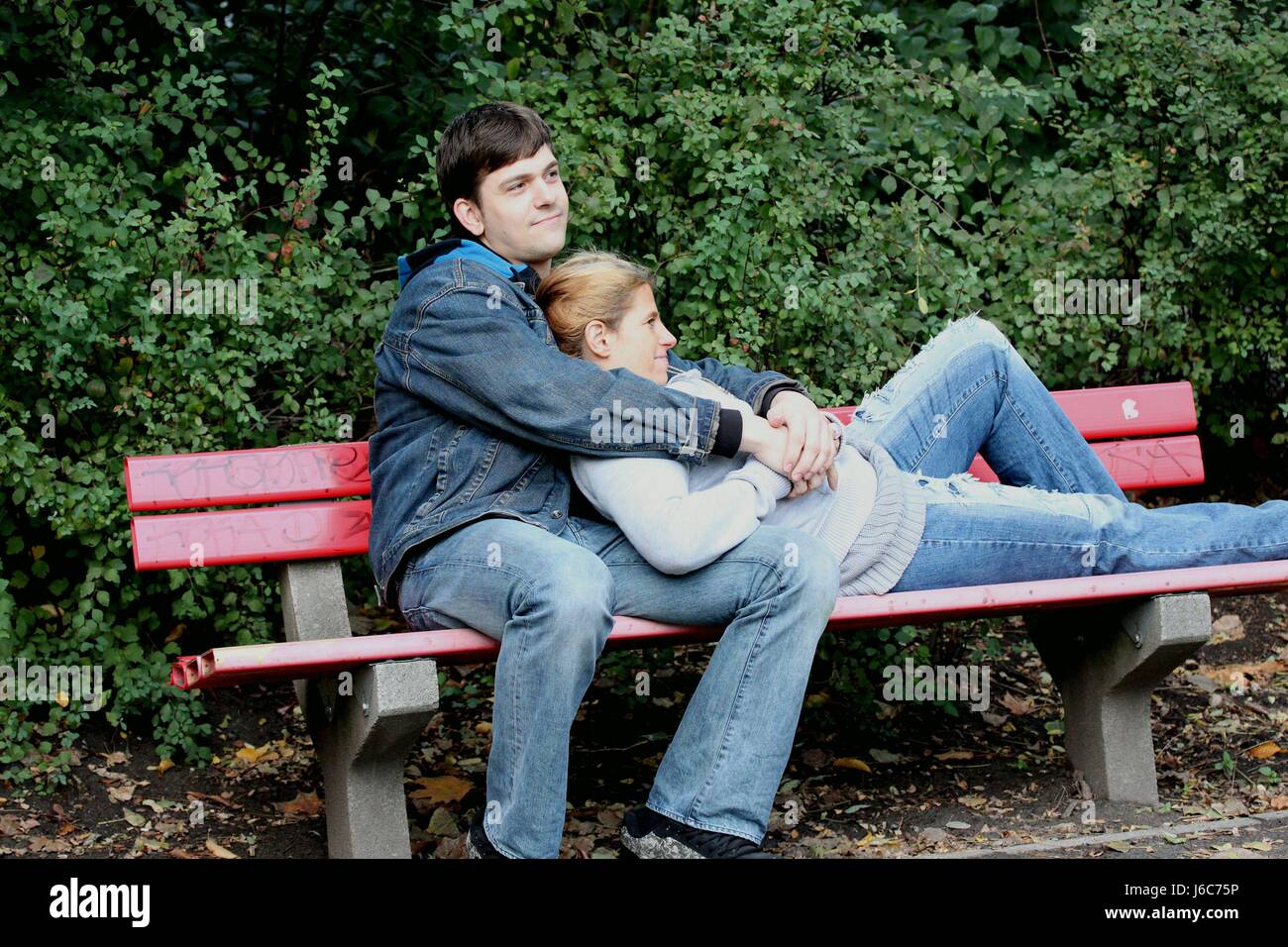 woman cuddle love in love fell in love seat bench park bench hug ...