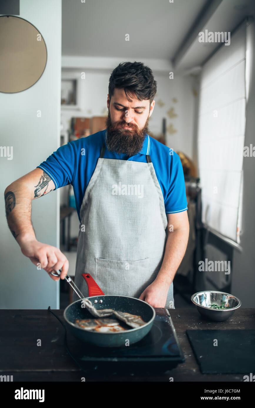 Hand cutting sea bass fillet hi-res stock photography and images - Alamy