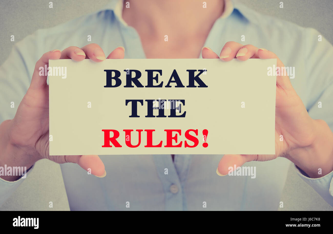Closeup businesswoman hands holding white card sign with break the ...