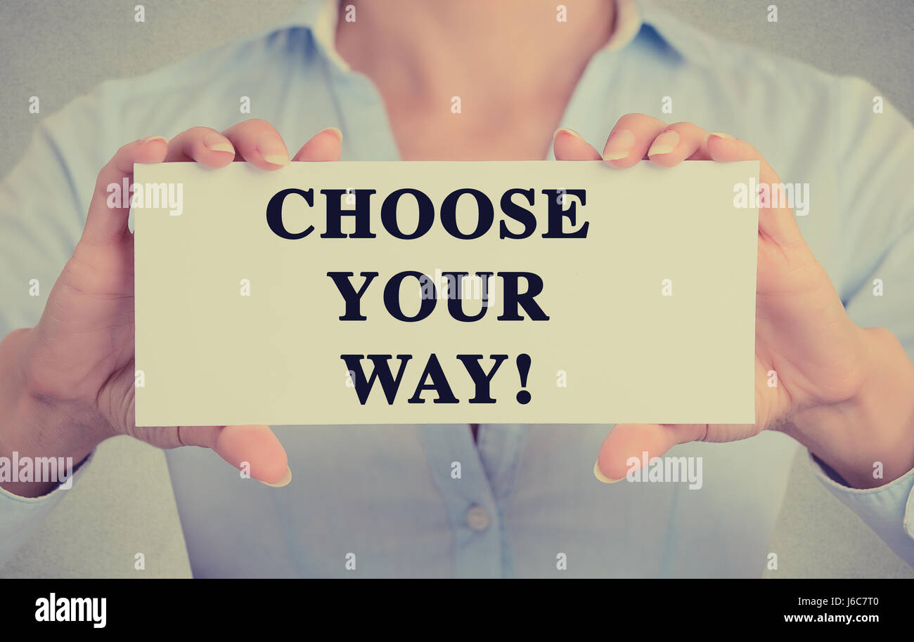 Closeup businesswoman hands holding white card sign with choose your ...