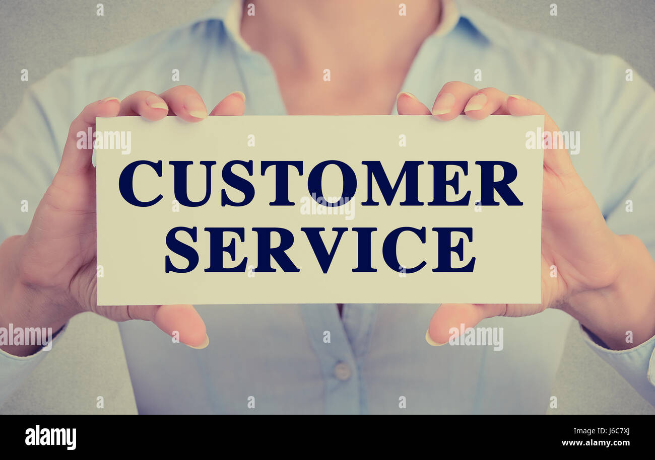 Businesswoman hands holding white card sign with customer service text ...
