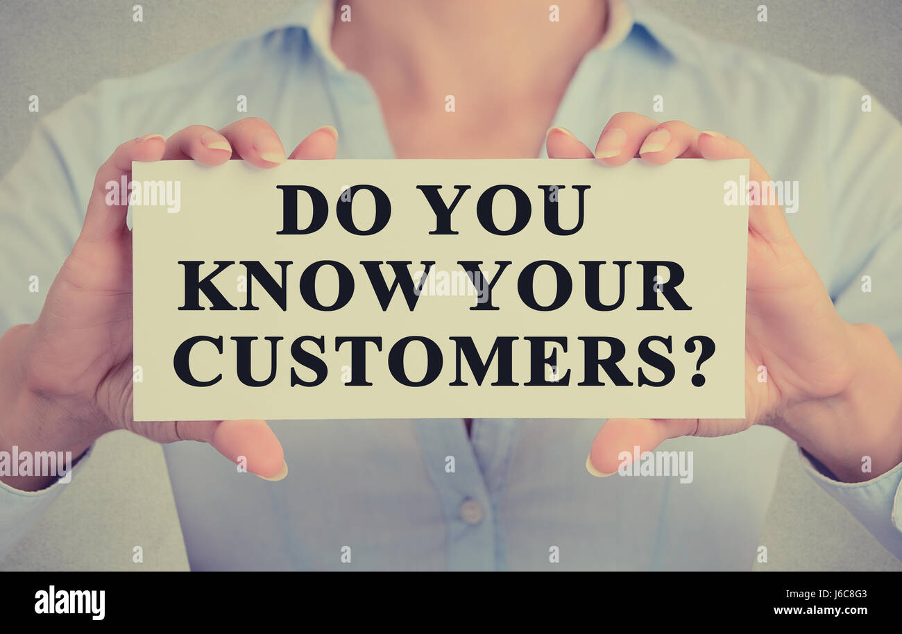 Closeup retro image businesswoman hands holding white sign or card with ...