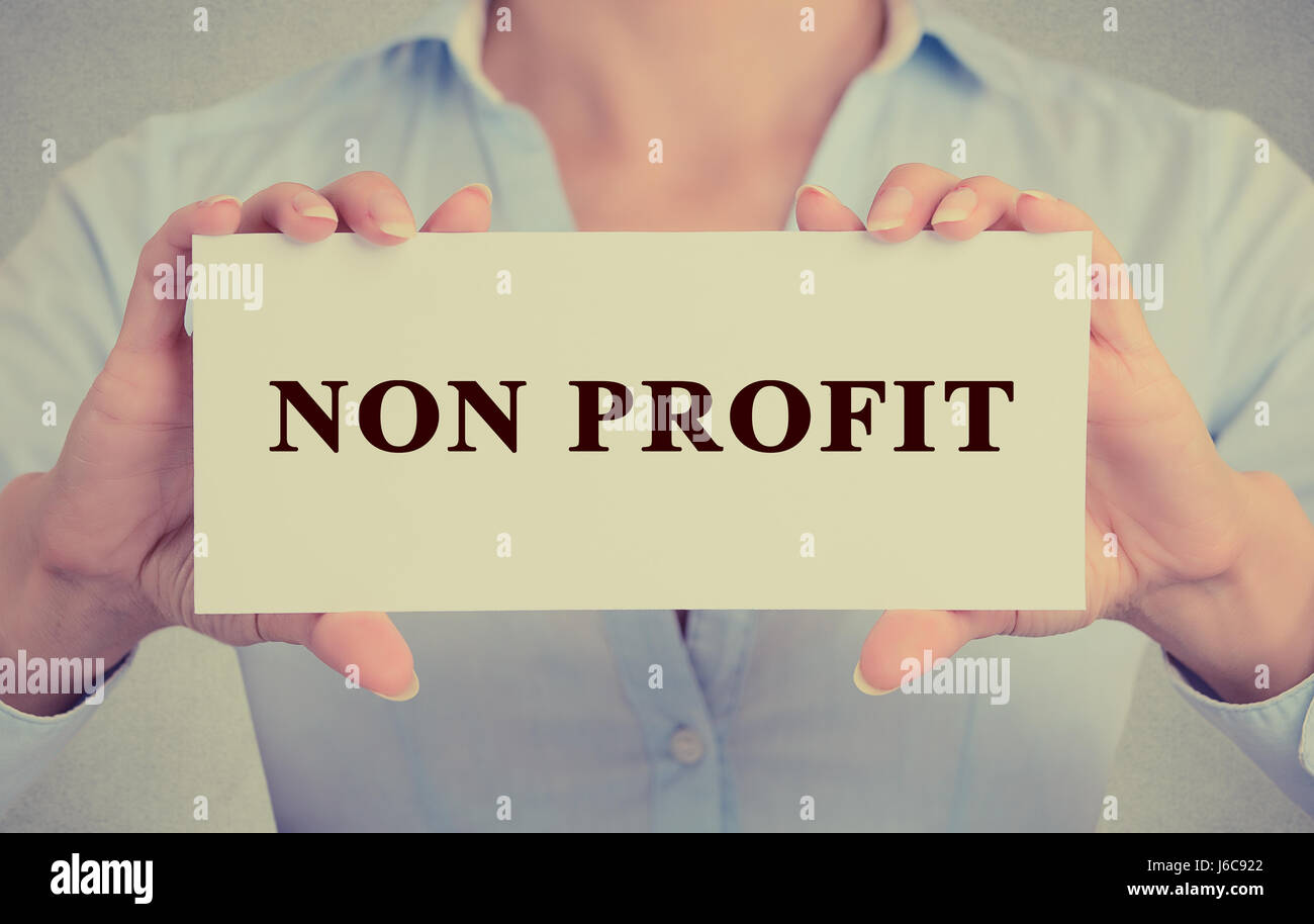 Businesswoman hands Holding Small White Sign card with Non Profit Text ...