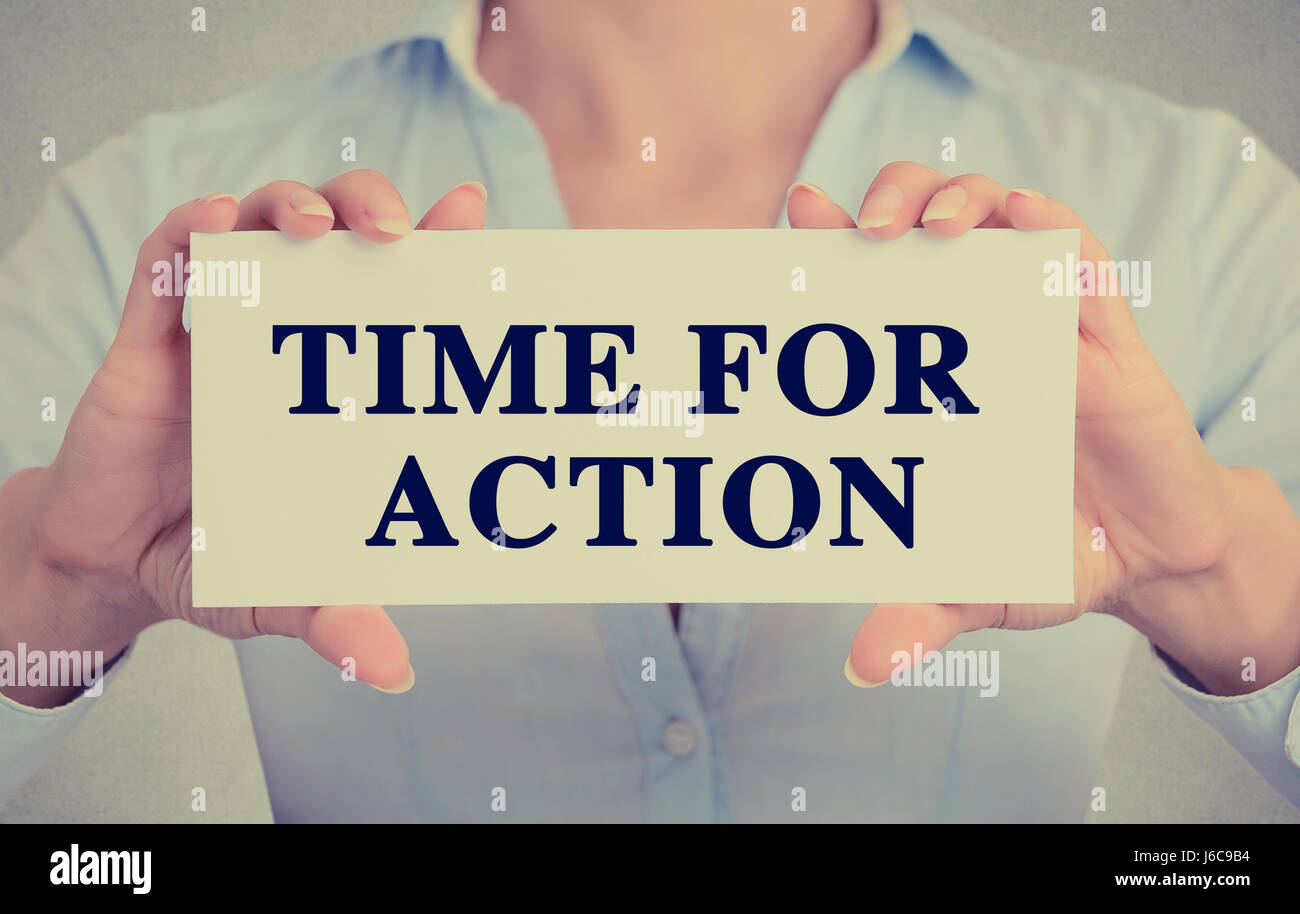 Closeup businesswoman hands holding white card sign with time for ...