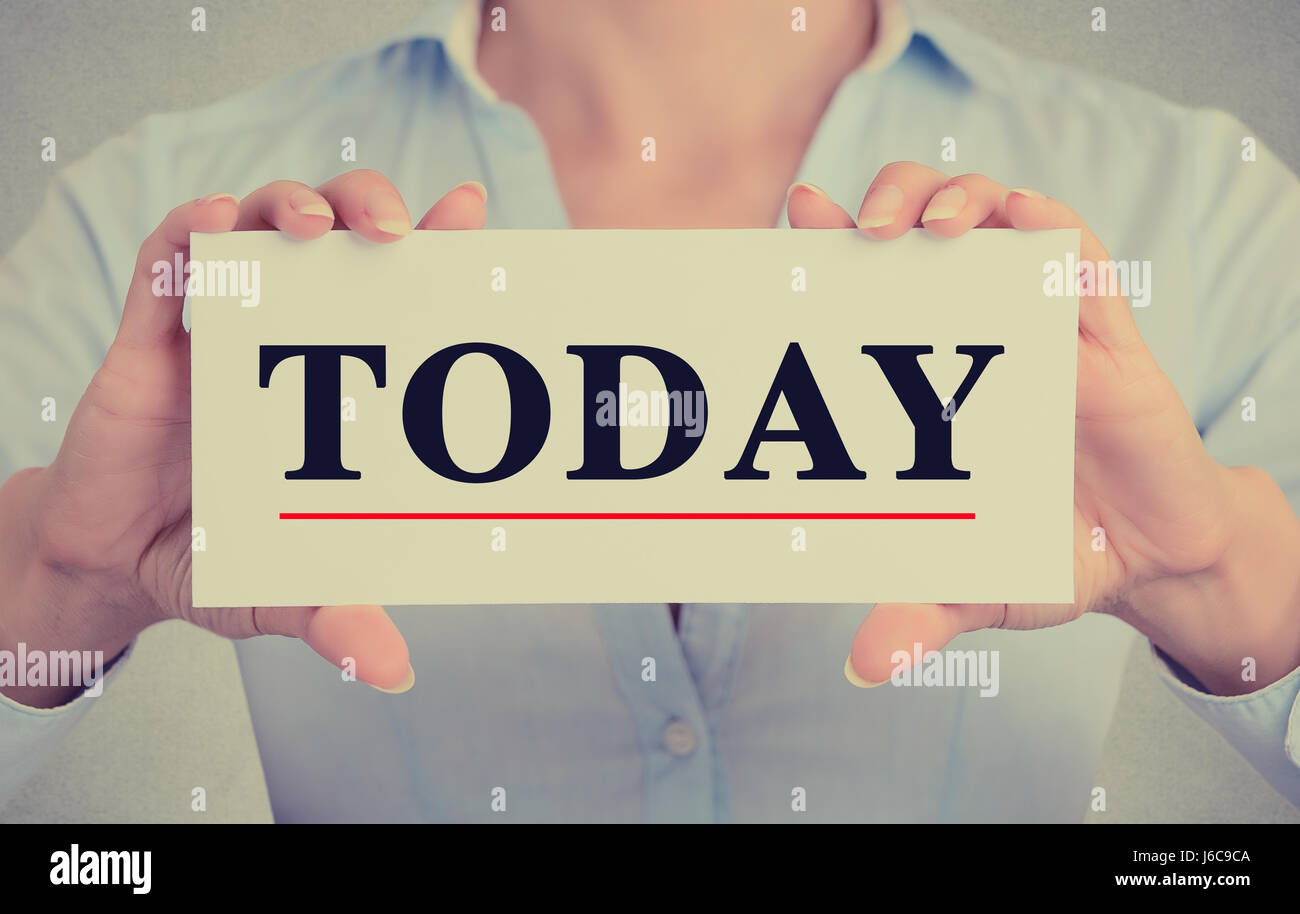 Businesswoman hands holding white card sign with today text message ...