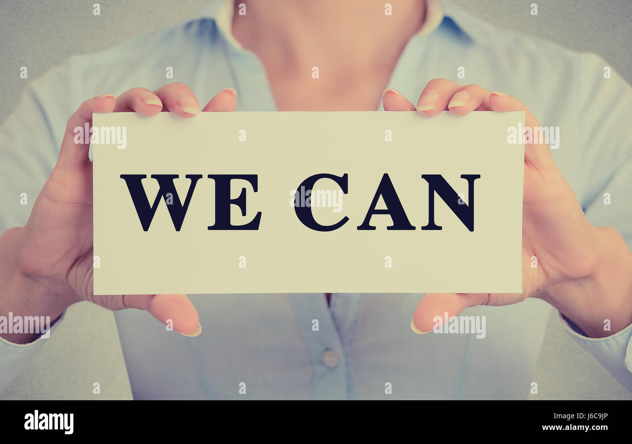Closeup businesswoman hands holding white card sign with we can text ...