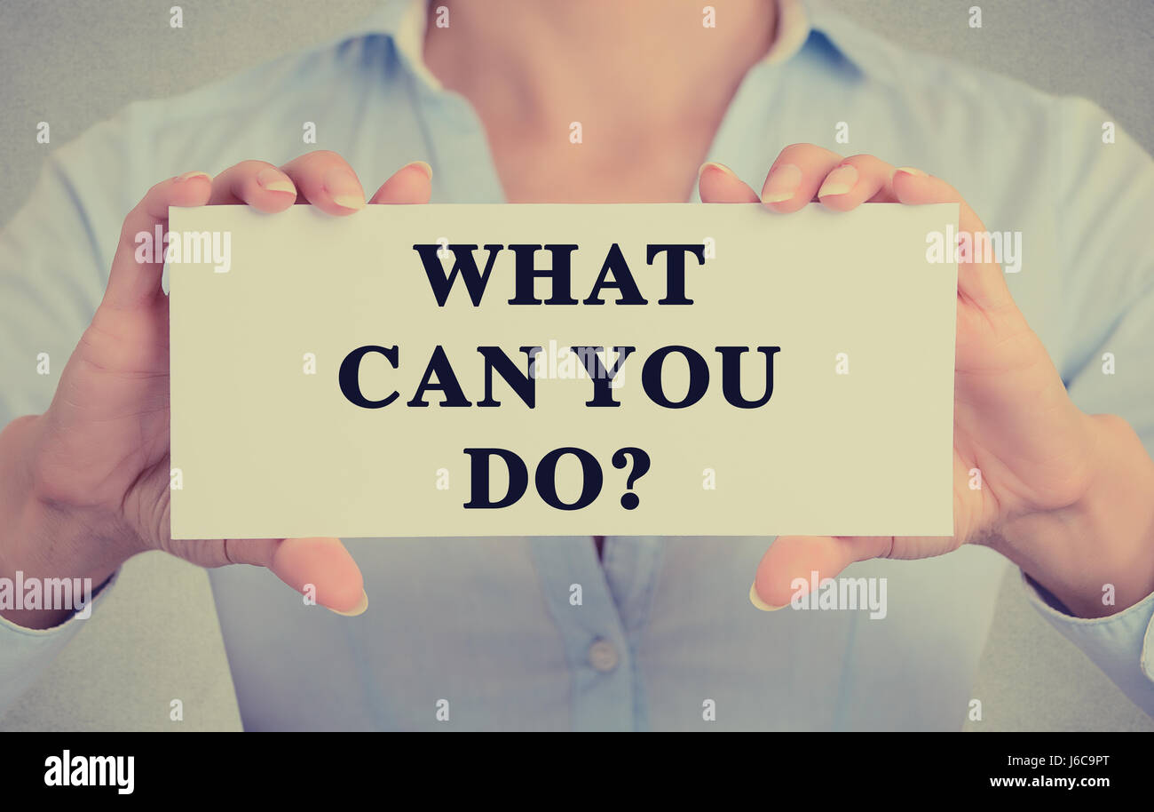 Businesswoman hands holding white card sign with What can you do? text ...