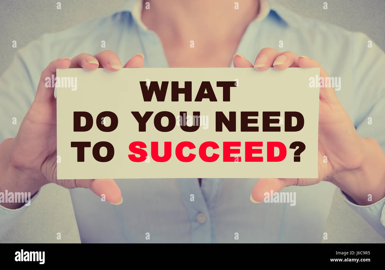 Businesswoman hands holding white card sign with what do you need to ...