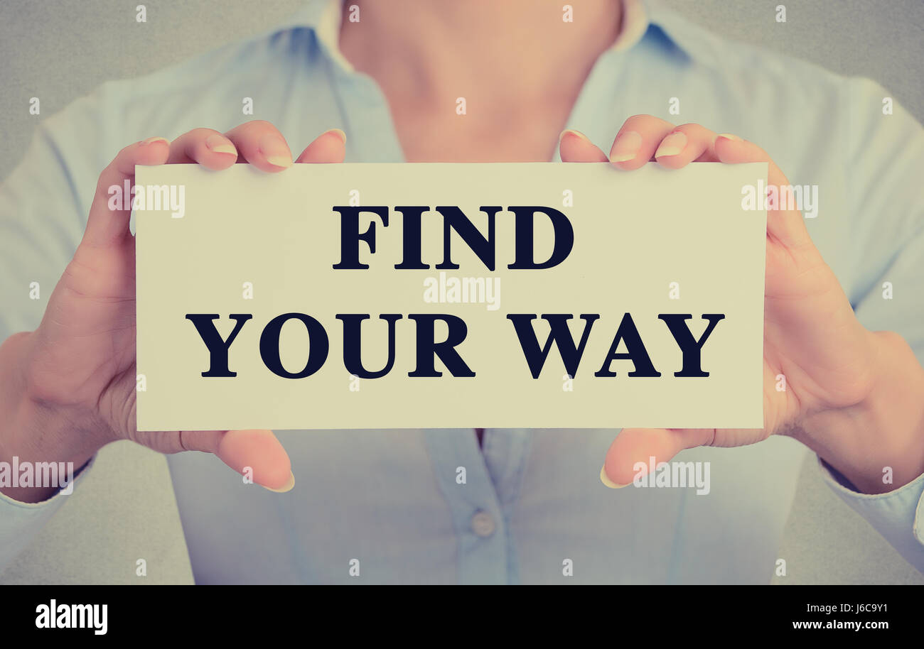 Closeup businesswoman hands holding white card sign with find your way ...