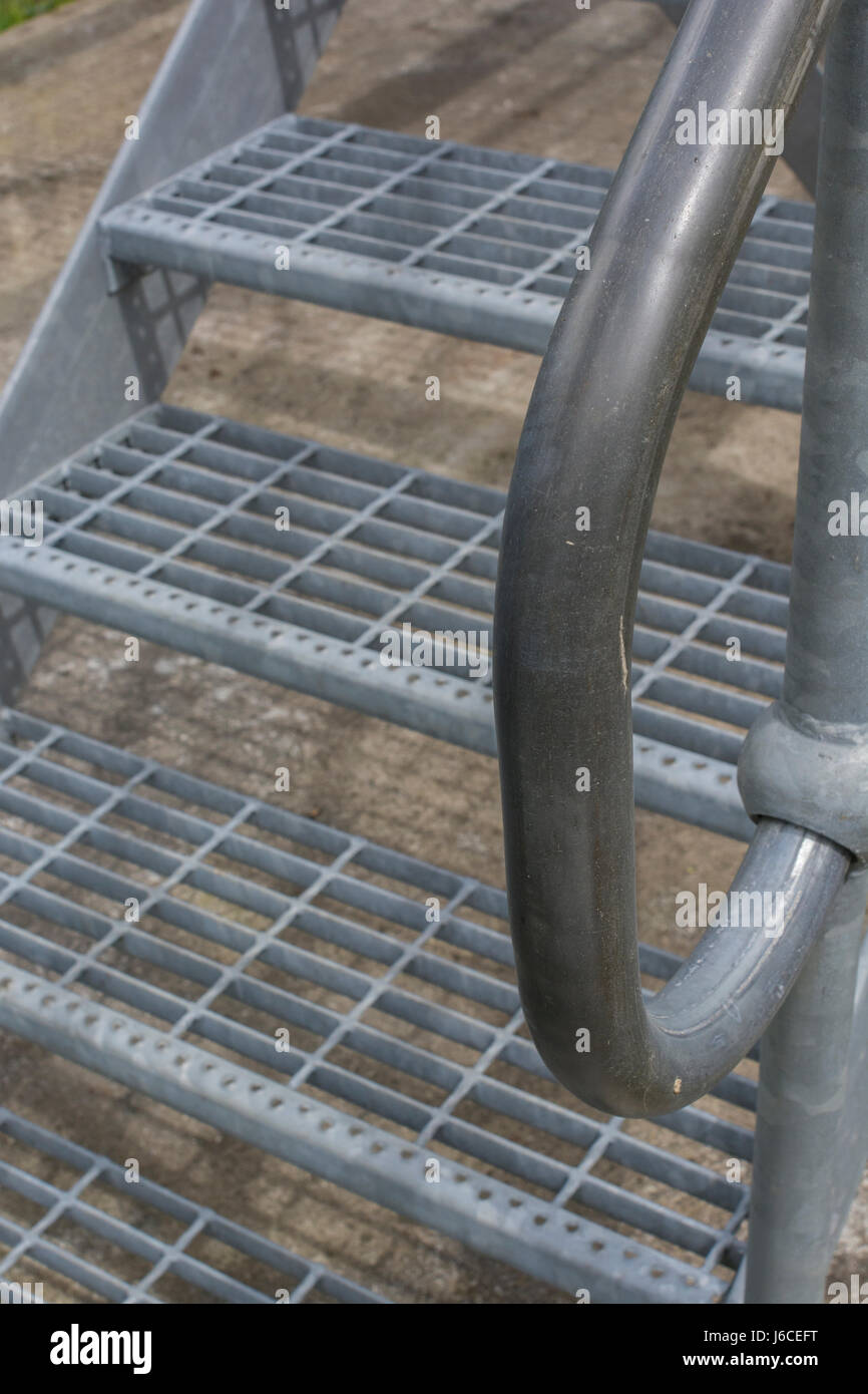 Set of three galvanized industrial safety steps with handrail Stock ...
