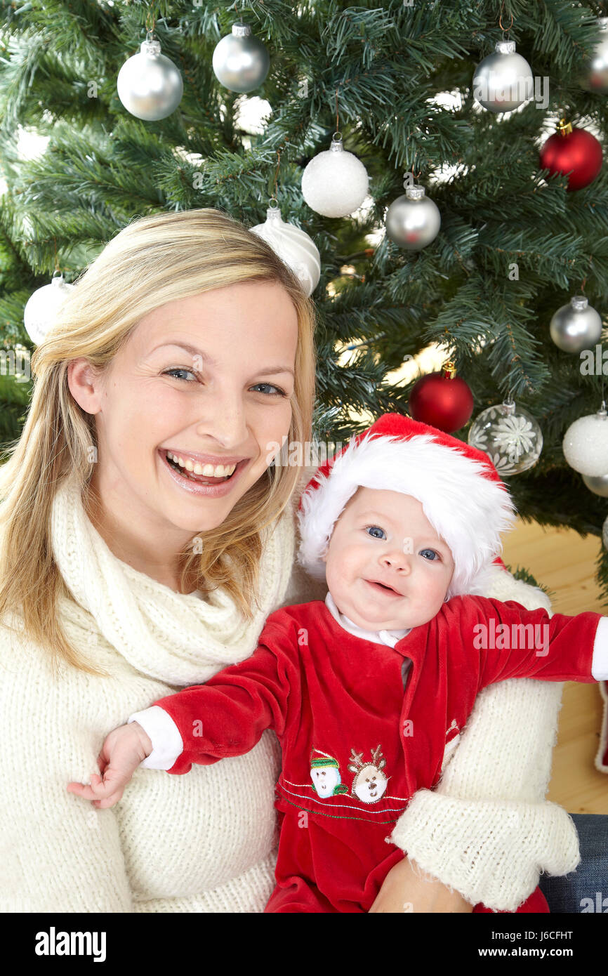 baby in santa claus costume with mother Stock Photo - Alamy