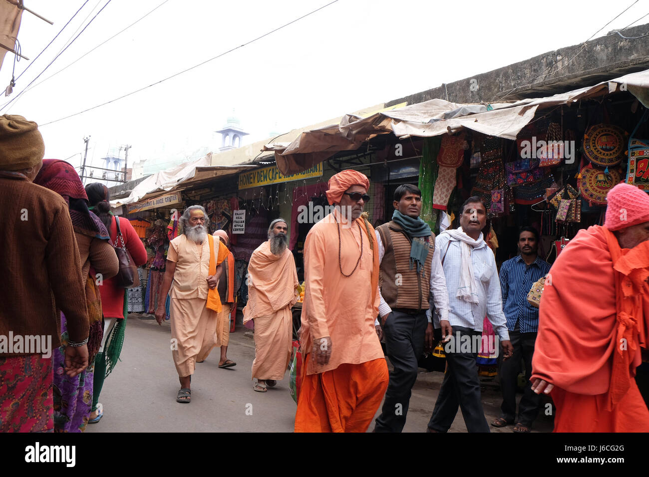 An unidentified Indian sadhu holy man walking at the bazaar and collect ...