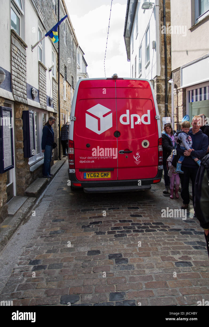 ST IVES, CORNWALL, UK - APRIL 18, 2017. A red delivery van from the ...