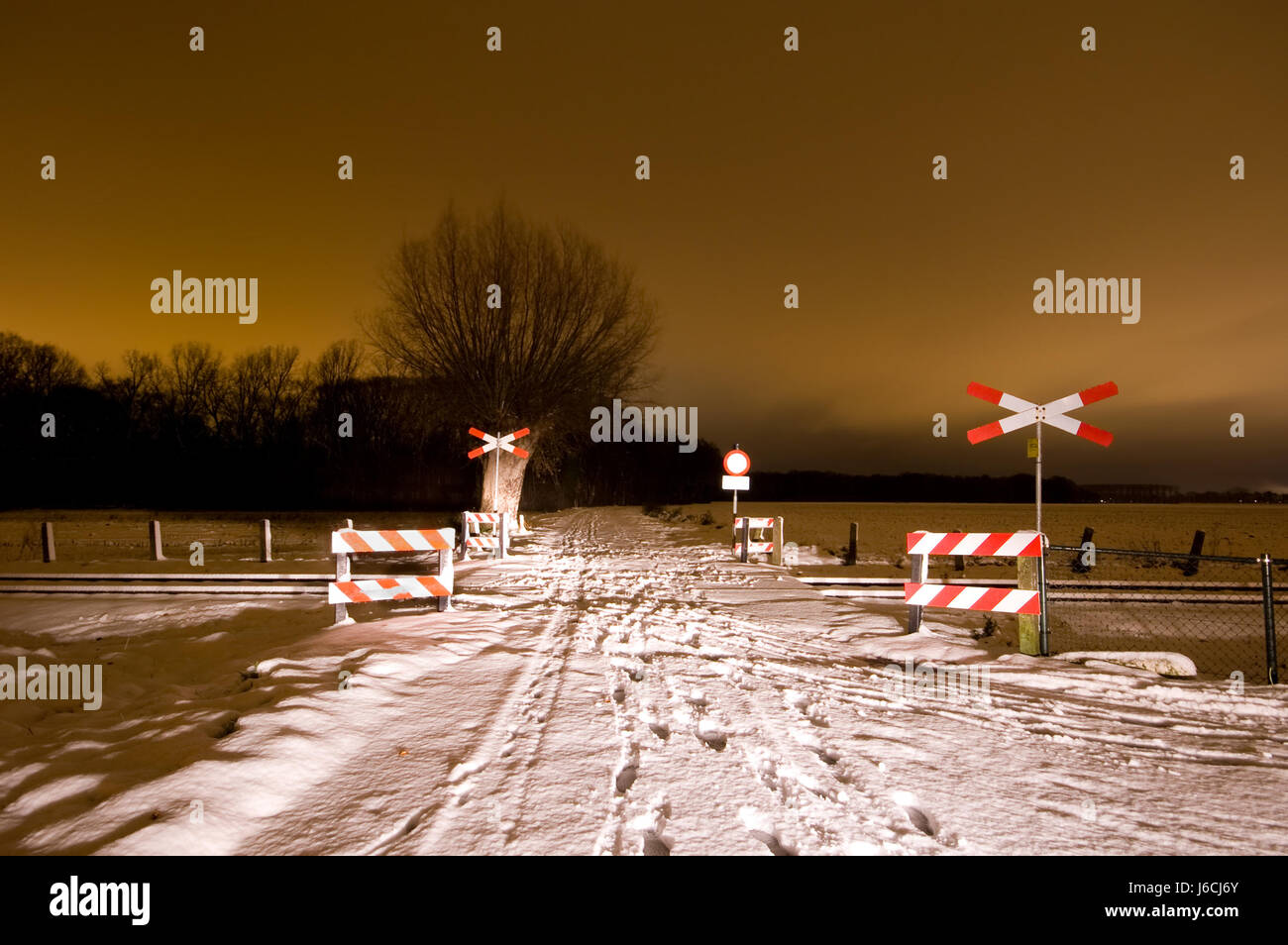 winter cold warning sign crossing white red ice winter night nighttime ...