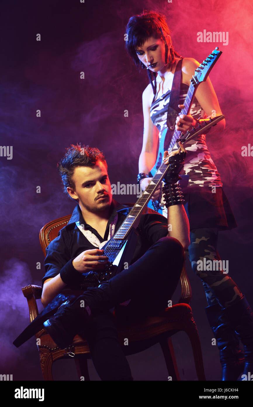 Two guitarists playing on stage at a rock concert Stock Photo - Alamy