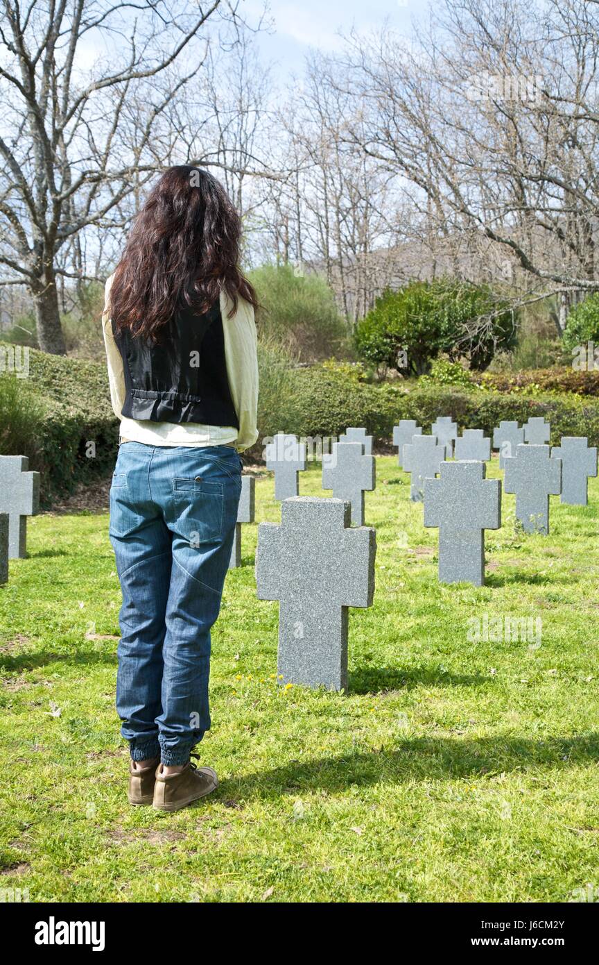 woman religion sad spain cemetery burial meadow grass lawn green woman ...