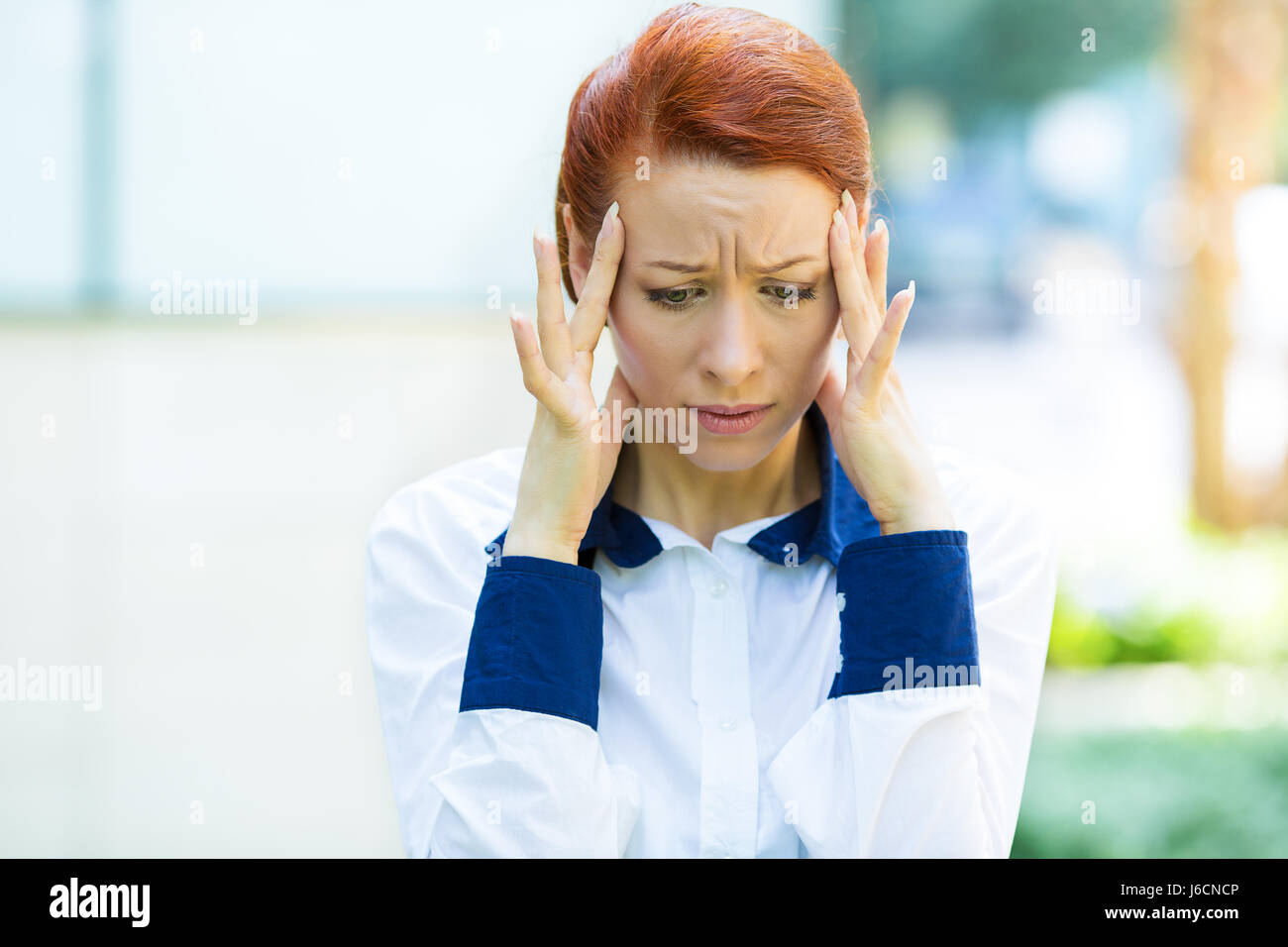 Closeup portrait unhappy business woman, hands on head standing ...