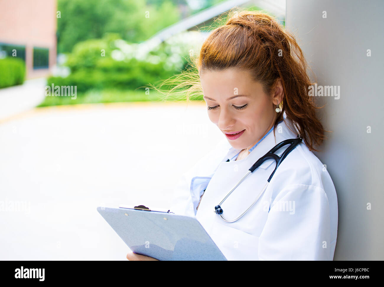 Closeup portrait, young confident female doctor, healthcare ...