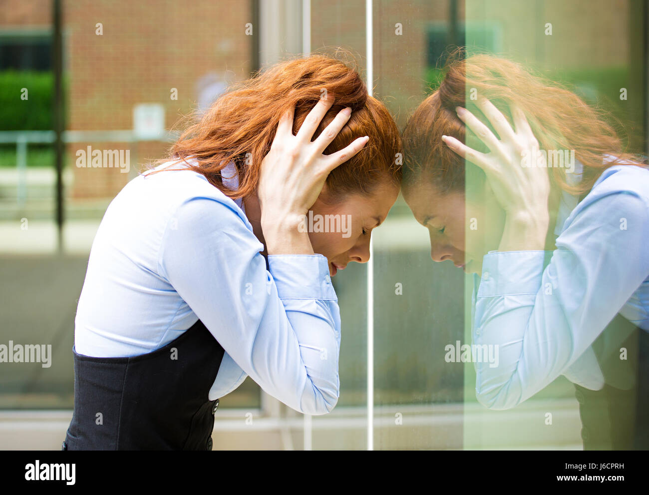 Closeup portrait unhappy sad young business woman head on window ...