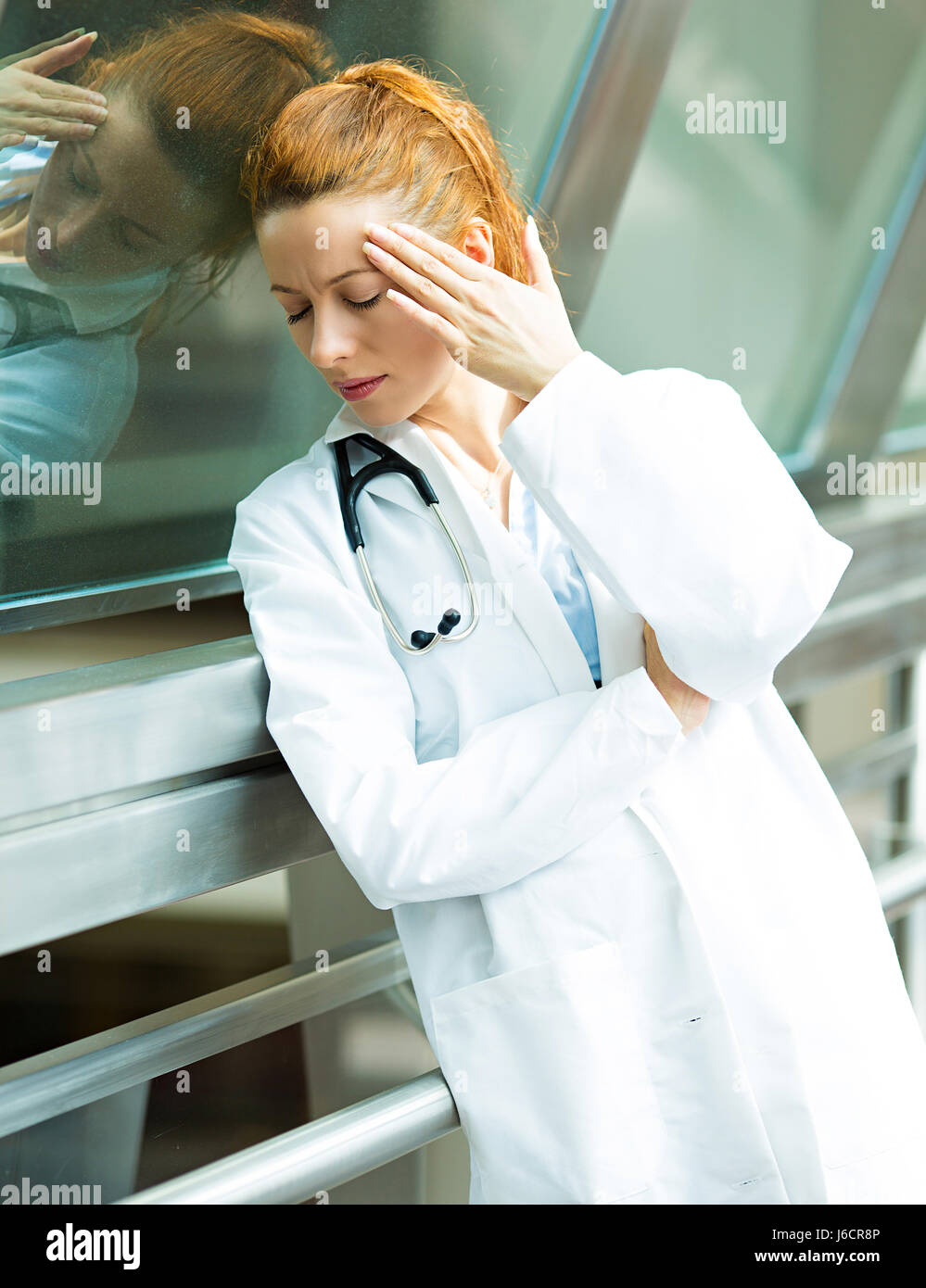 Closeup portrait sad health care professional with headache, stressed ...