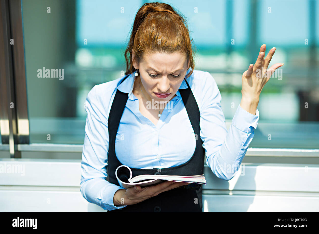 Closeup portrait confused, puzzled, surprised business woman reading ...