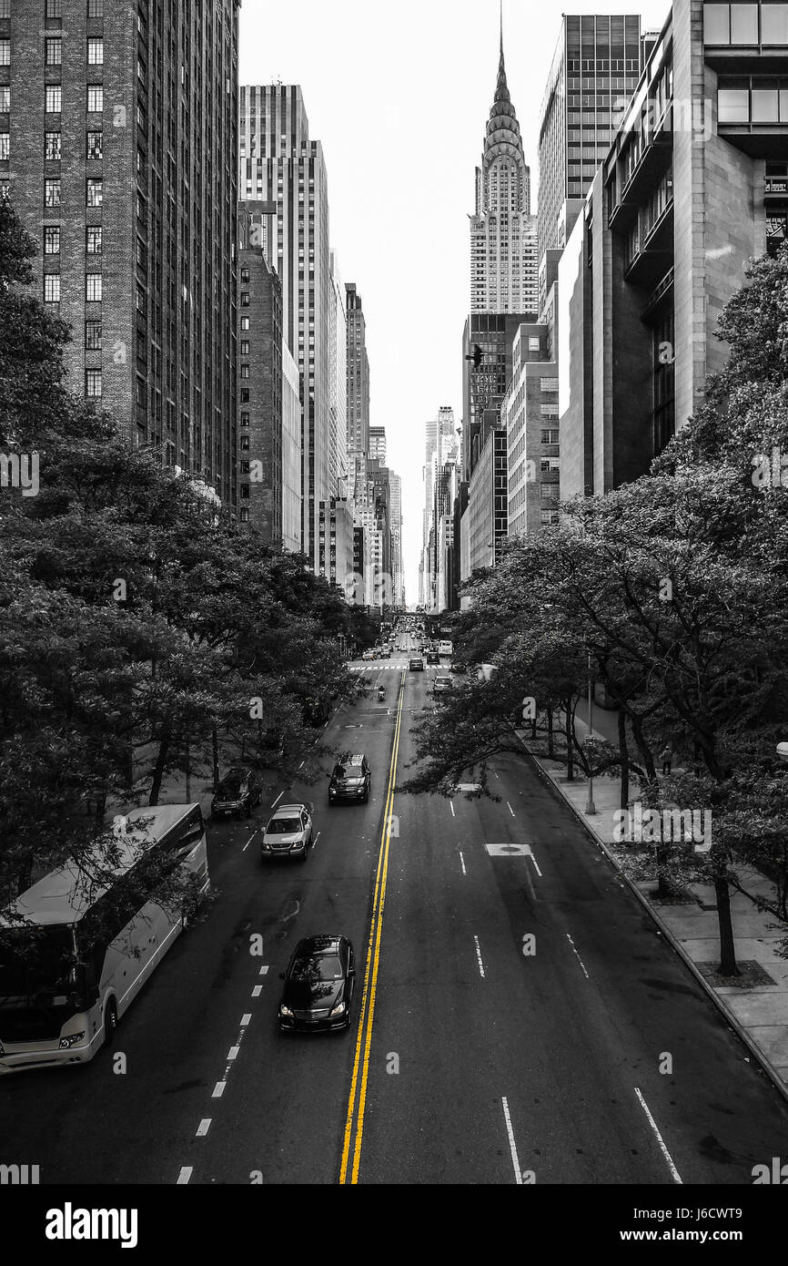 Endless streets of Manhattan New York skyscraper cars yellow lane ...