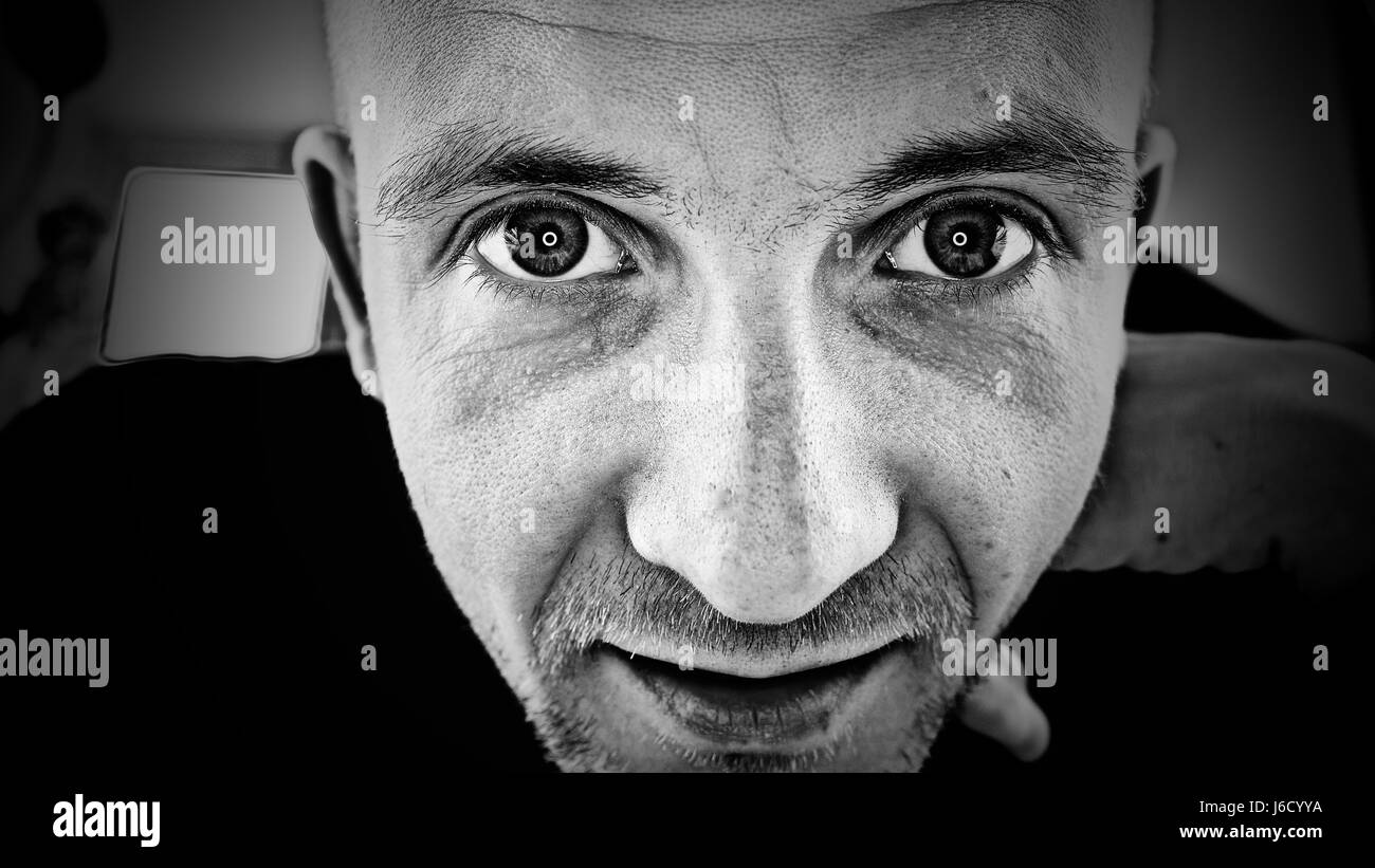 Young man head in black scene Stock Photo - Alamy