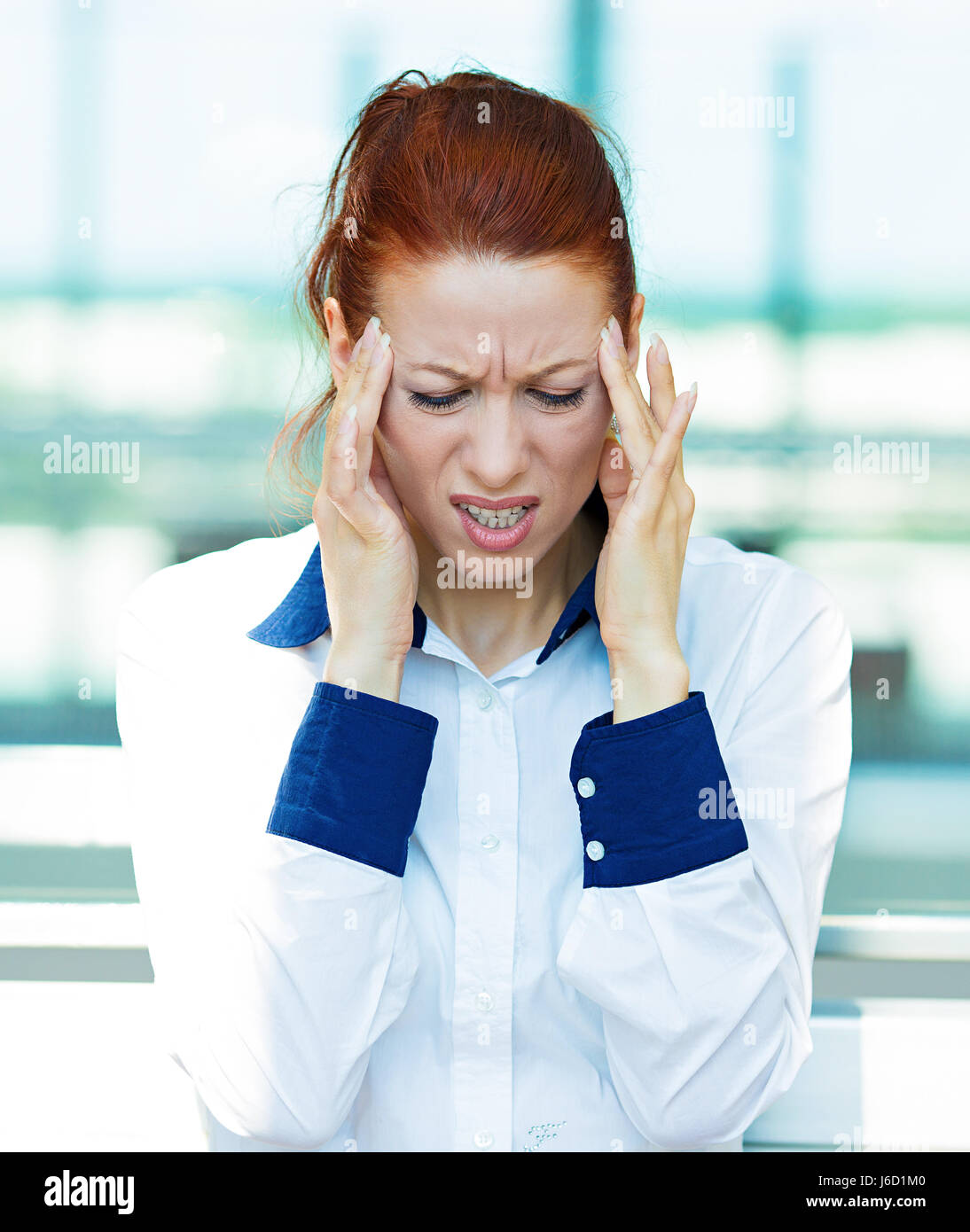 Closeup portrait sad unhappy young business woman, hands on head ...