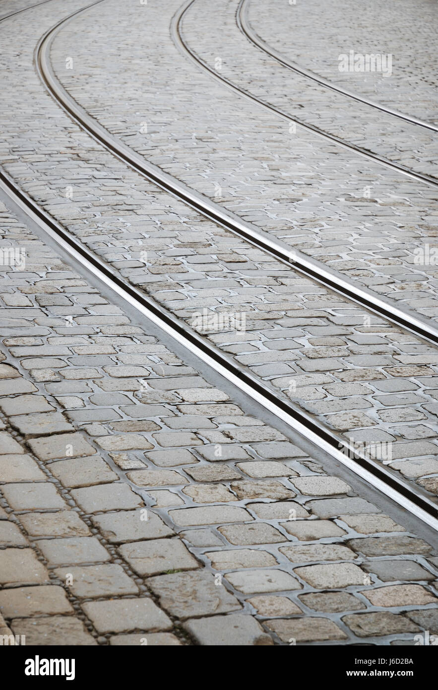 tracks rail track bend cobblestone curve street road detail traffic ...