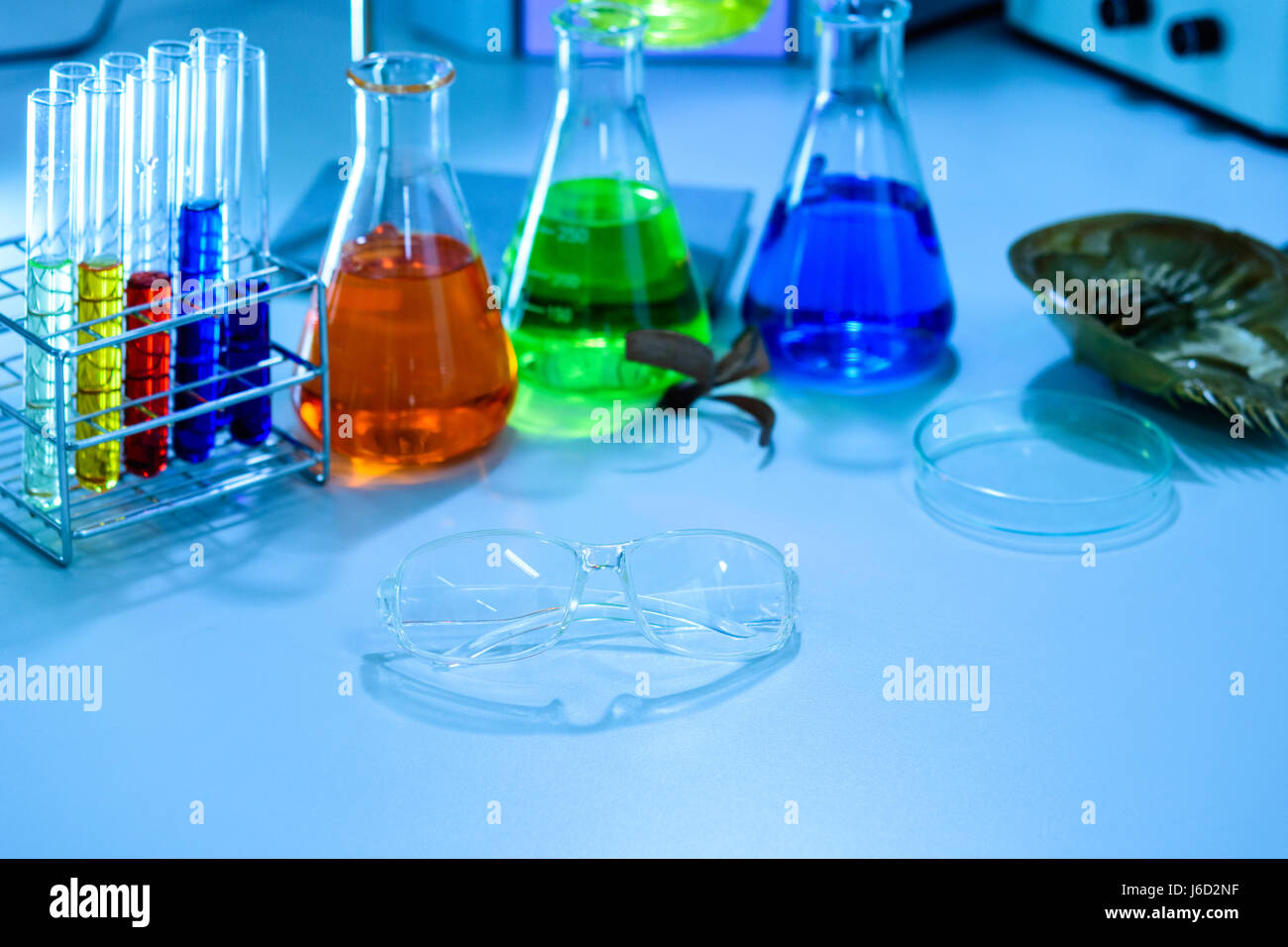 Glasses and scientific experiments in laboratory Stock Photo - Alamy