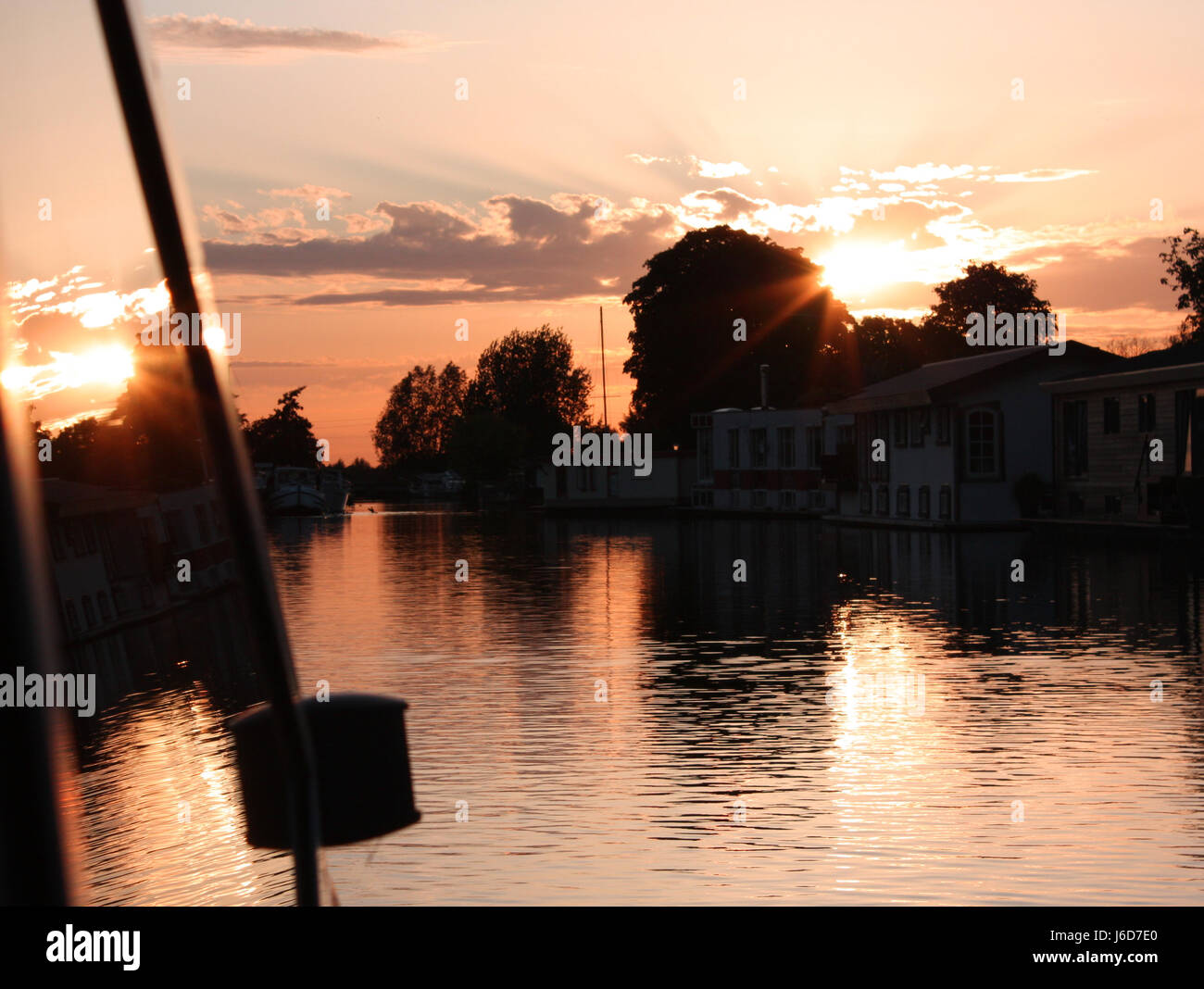 sunset harbor counter-light holland evening light harbours shine shines ...
