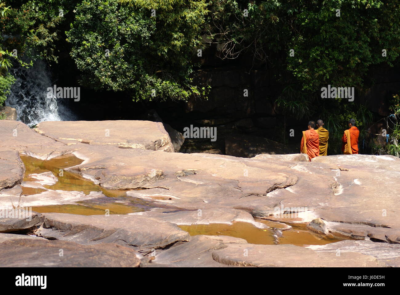 monks at waterfall Stock Photo - Alamy