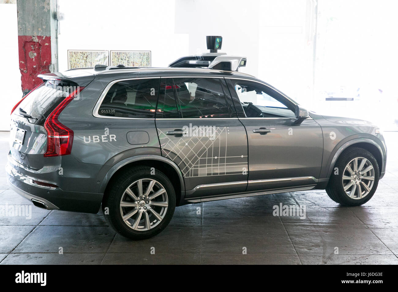 An Uber logo on a Uber Technologies Inc., self-driving autonomous Volvo ...
