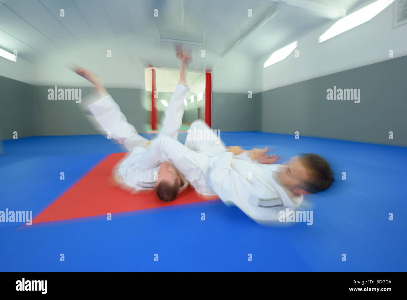 Blurred action shot of judo combat Stock Photo - Alamy