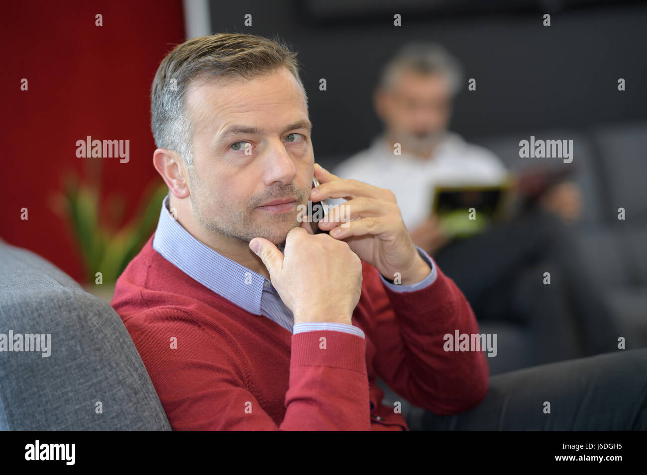 Man making phone call on mobile phone Stock Photo - Alamy