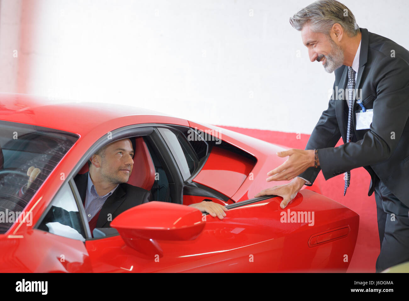 Sports car salesman hi-res stock photography and images - Alamy