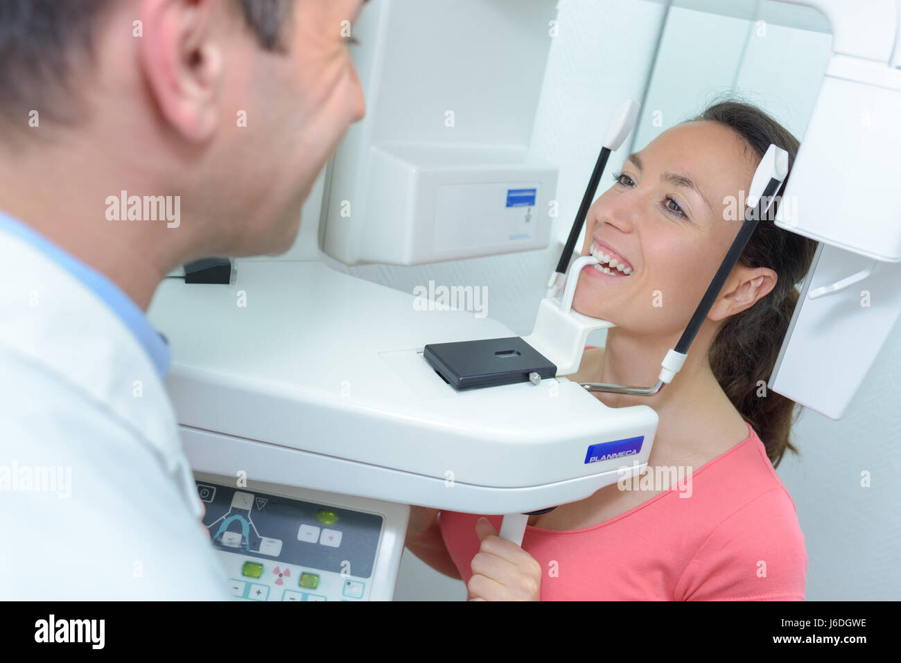 Lady biting apparatus for dental xray Stock Photo - Alamy