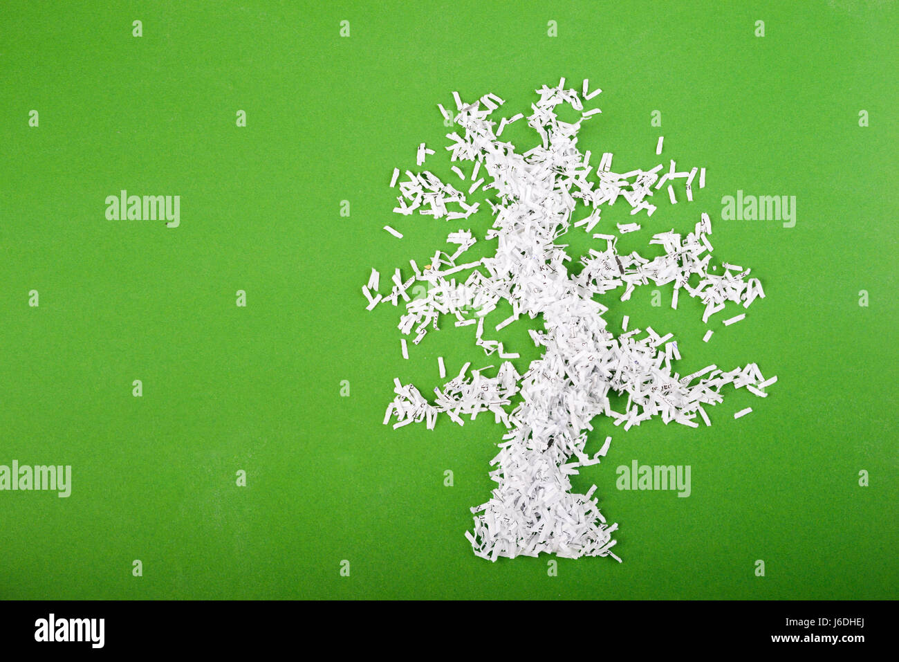 simple green tree symbol made from shredded paper particles on green ...